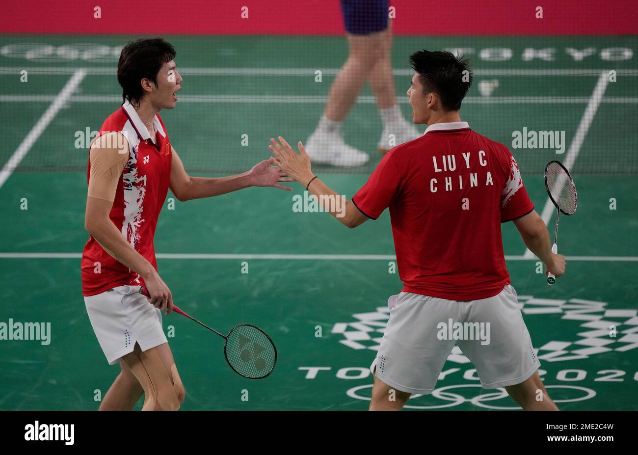 China's Li Jun Hui and Liu Yu Chen, right, celebrate a point against ...