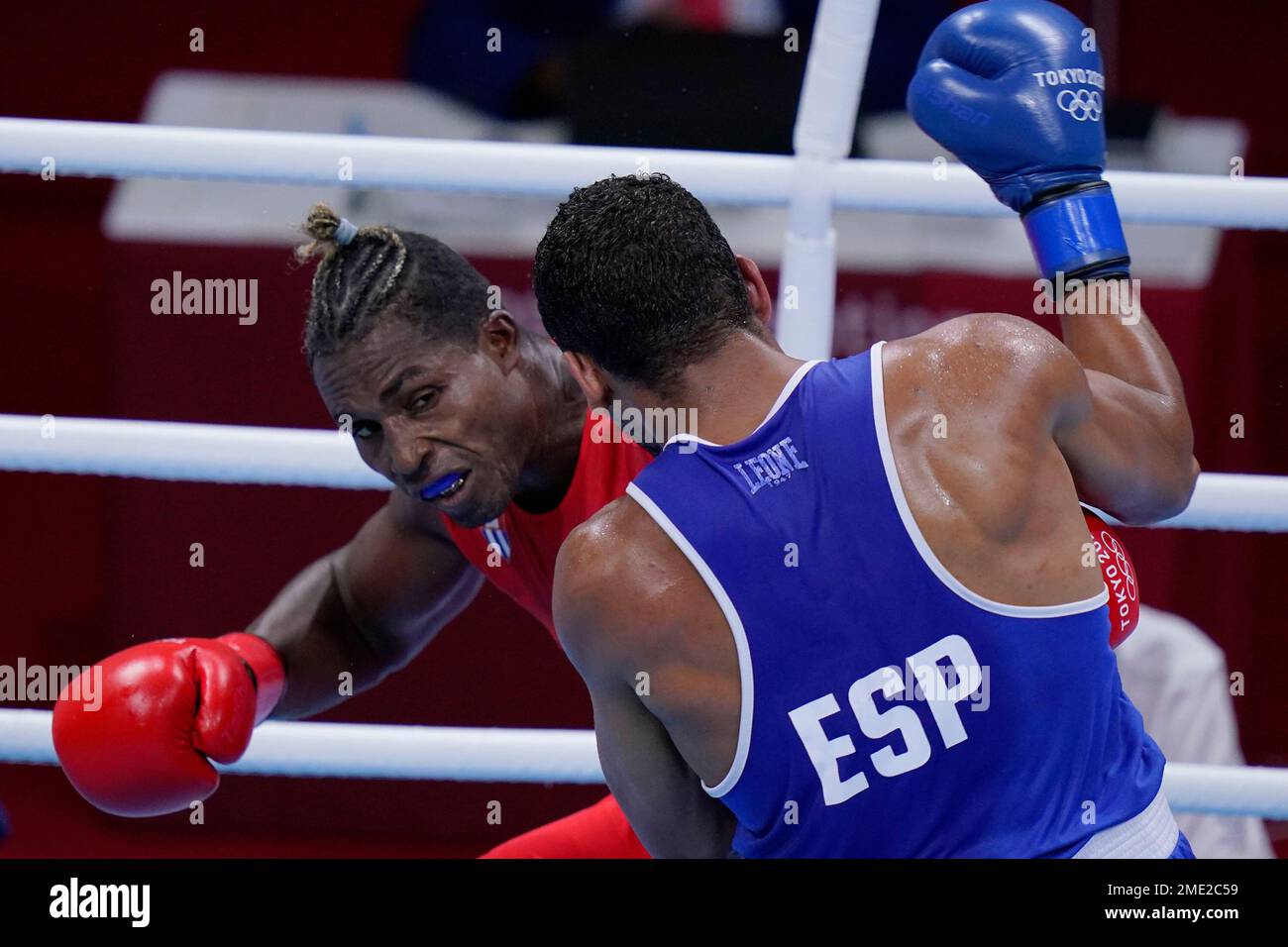 Cuba's Julio laCruz, left, exchanges punches with Spain's Emmanuel ...