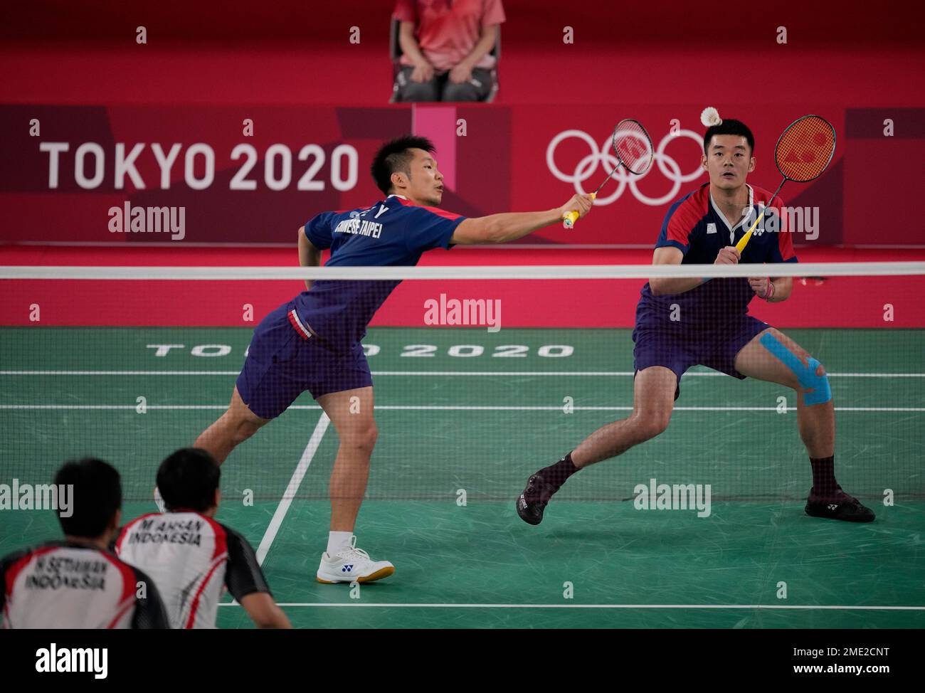 Taiwan's Lee Yang and Wang Chi-Lin play against Indonesia's Mohammad ...