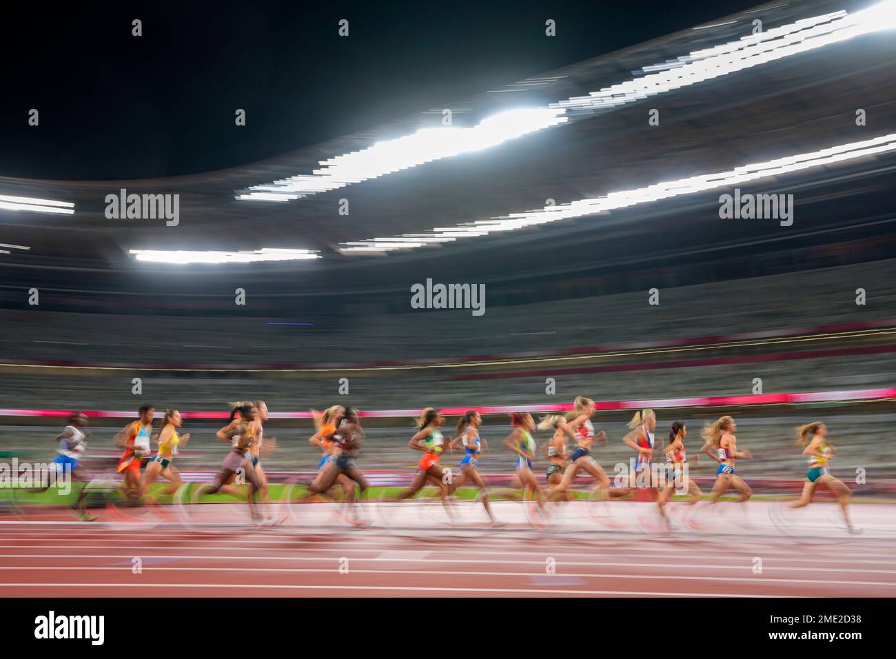 Runners compete in a heat of the women's 5,000-meter run at the 2020 ...
