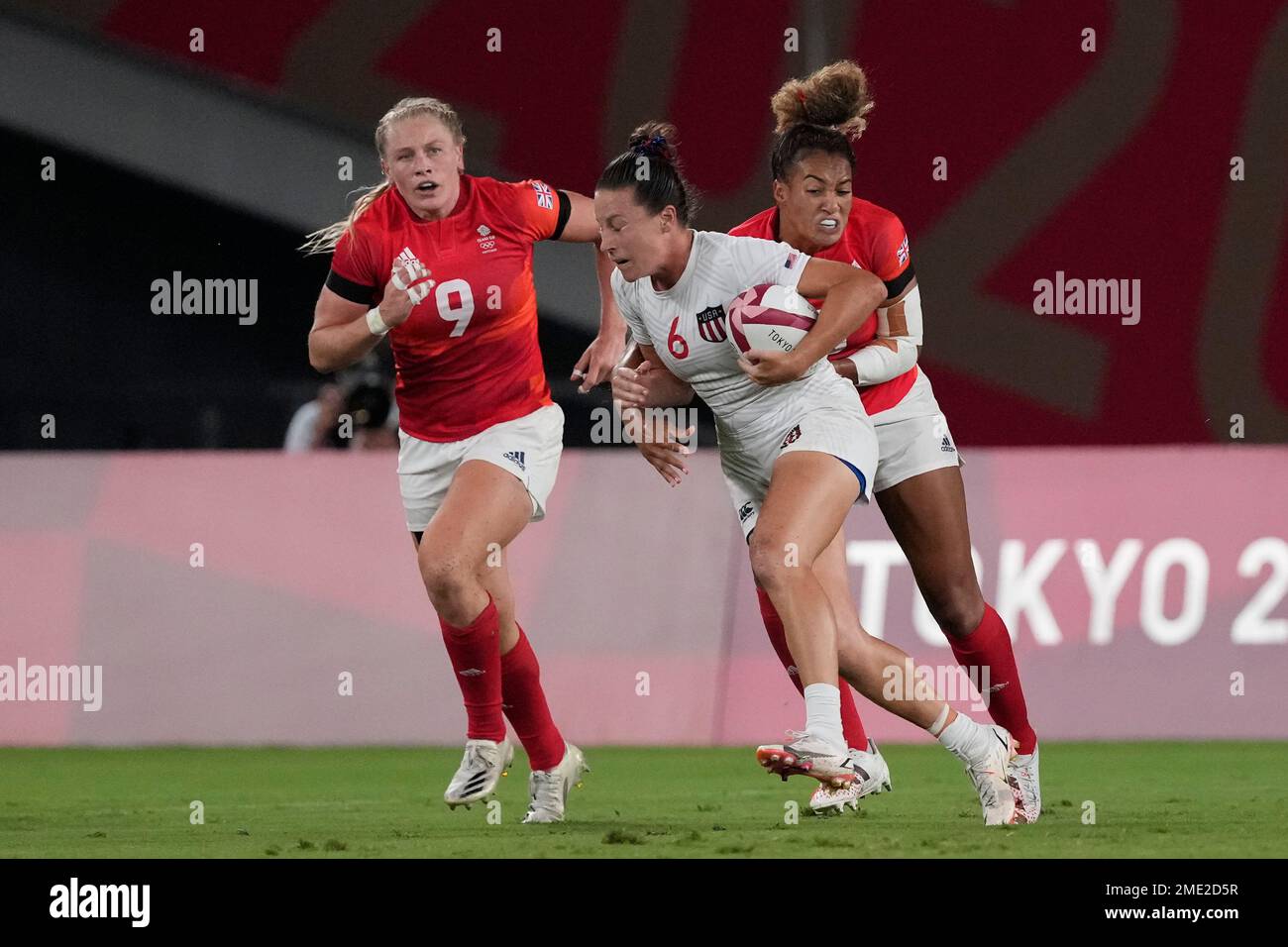 Lauren Doyle of the United States, center, comes under pressure from ...