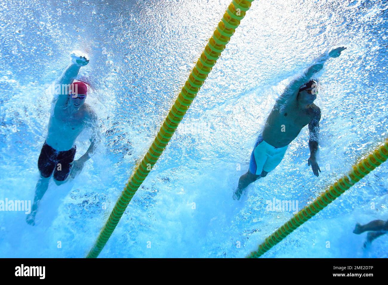 Caeleb Dressel, right, of the United States, swims to victory in heat ...