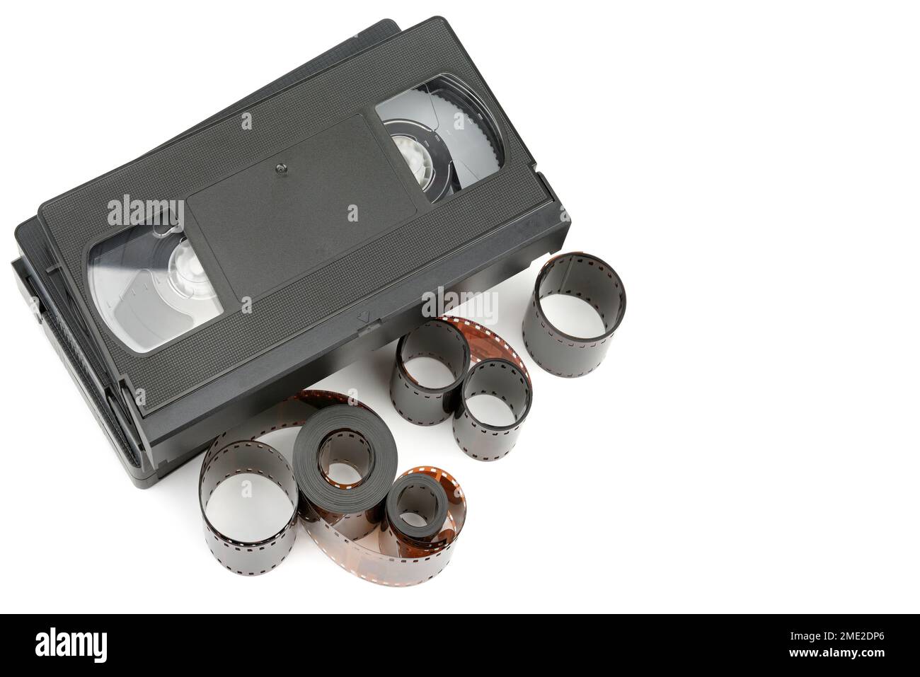 A set of video tapes and photographic film isolated on white background ...