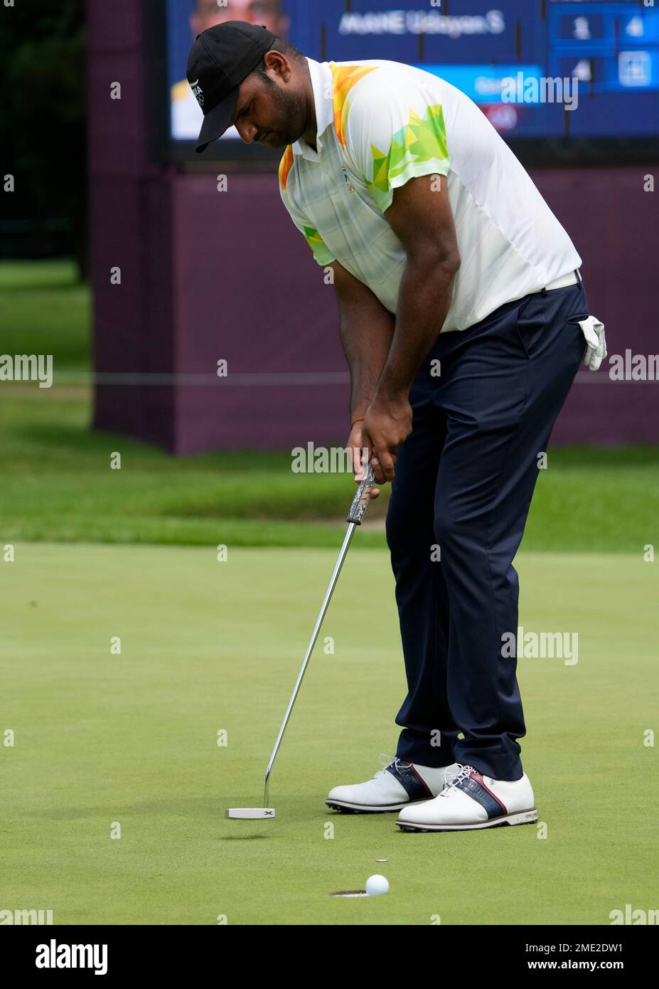 Udayan Mane of India fails a putt on the 7th green during the second ...