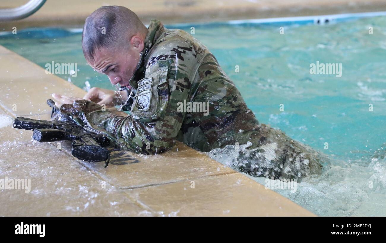 Completes the 15 meter swim portion of the combat water survival hi-res ...