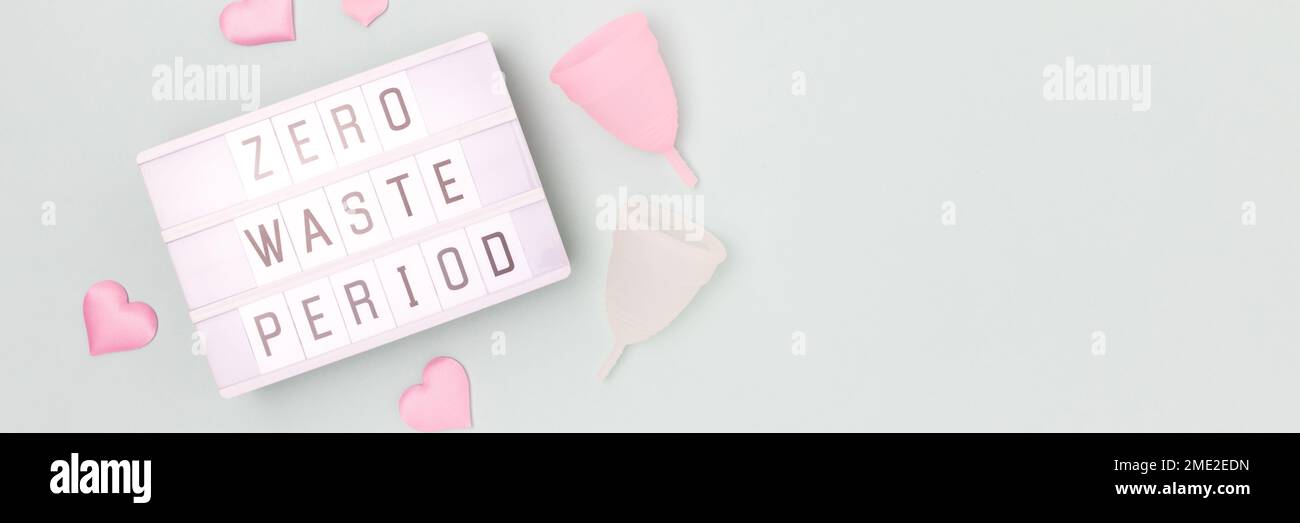 Zero waste period. Banner with lightbox with letters and menstrual cups ...