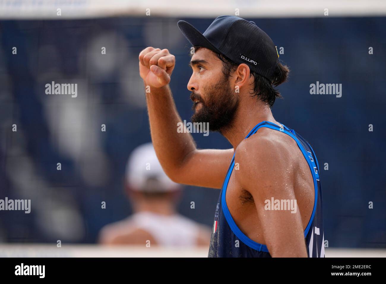 Daniele Lupo, of Italy, celebrates winning a men's beach volleyball ...