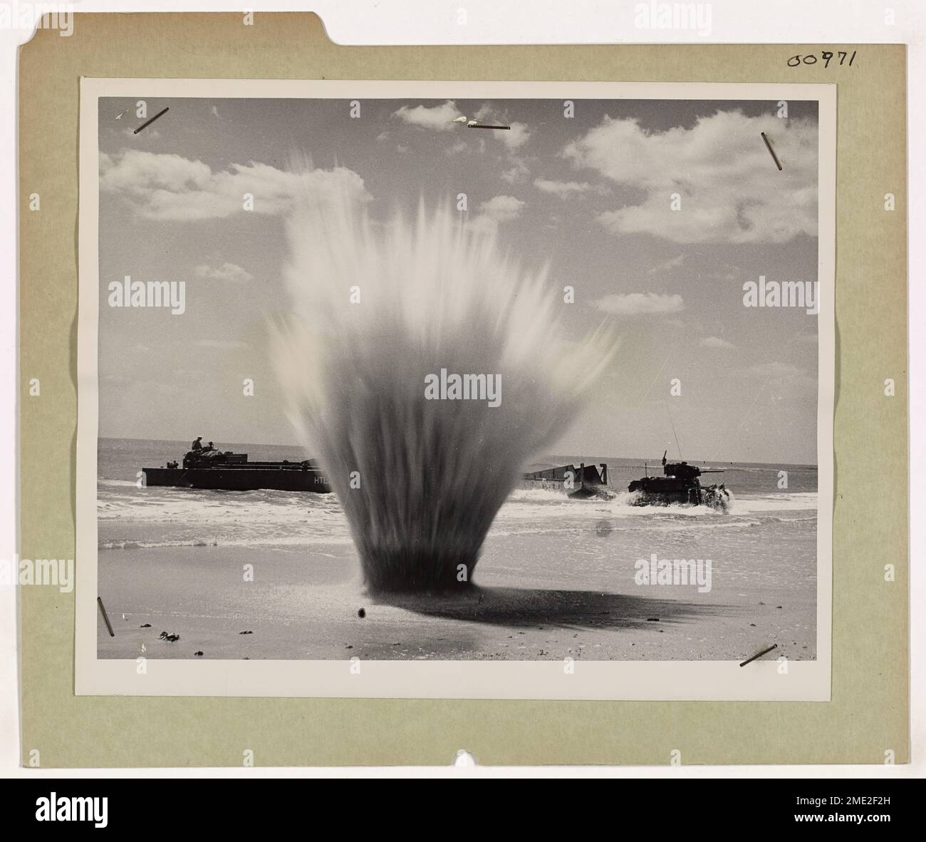 Coast Guard-manned landing barges bring tanks ashore during training ...