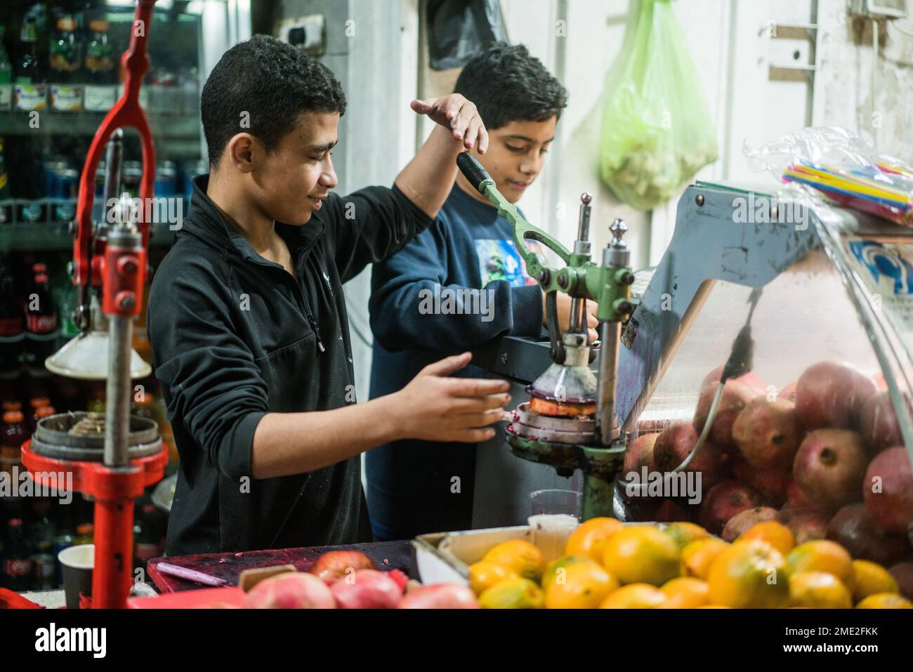 Street scene with boy making pomegranade juice in the Betlehem, Israel ...