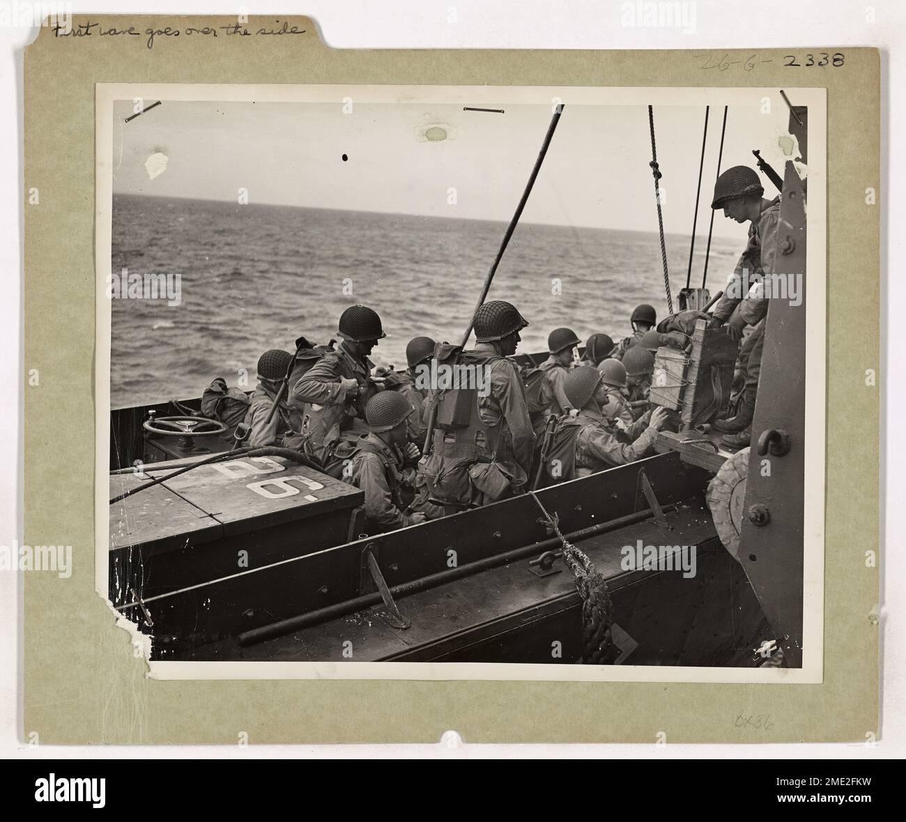 At H-Hour, the first wave of soldiers leap off a Coast Guard assault ...