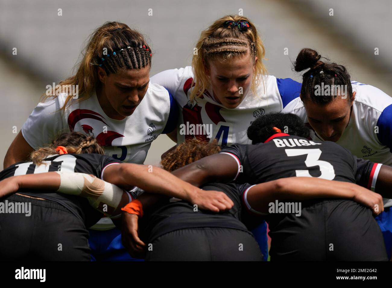 France, top, and Canada players set up for a scrum in their women's ...