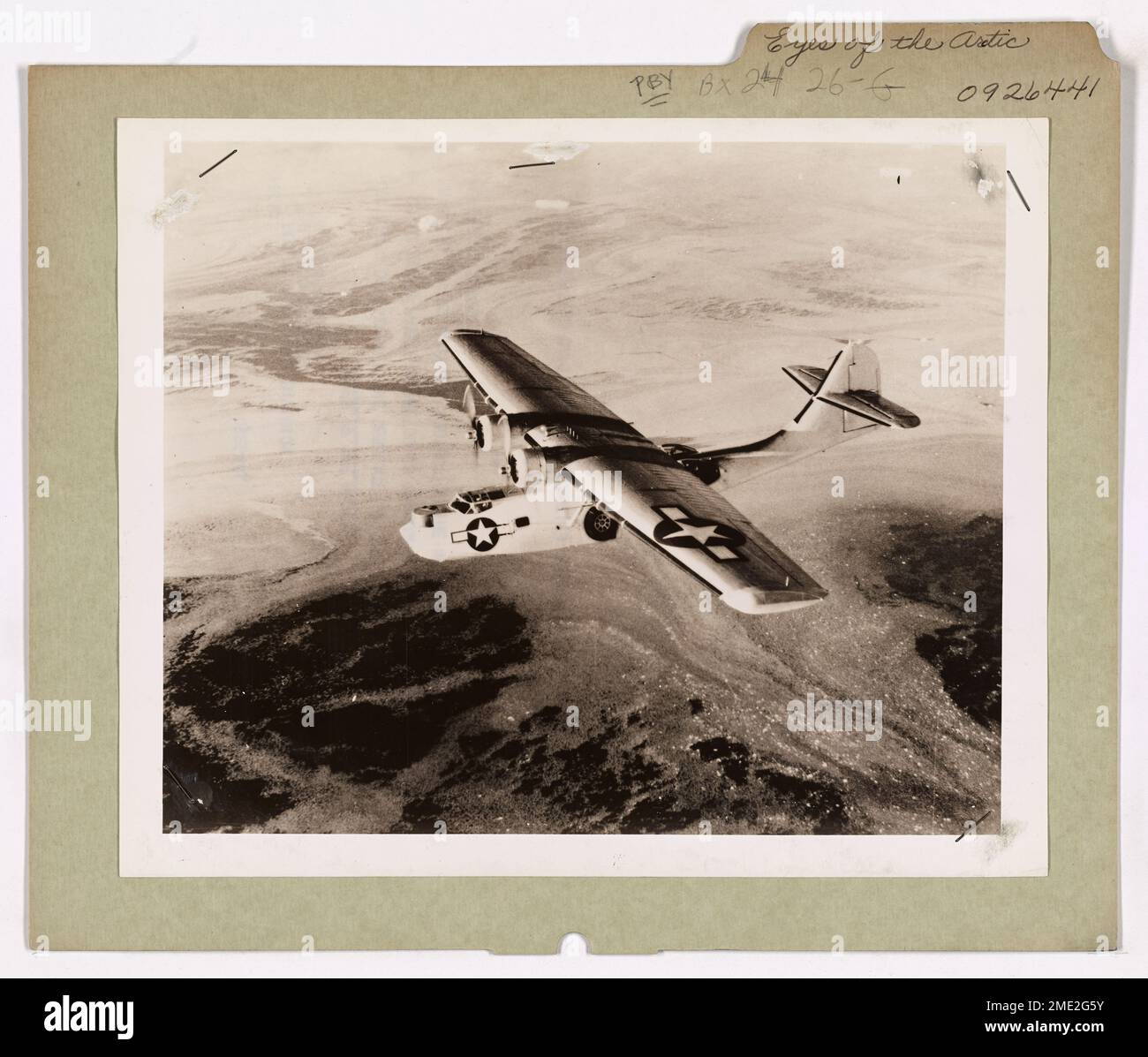 A U.S. Coast Guard patrol plane flies over the barren, frigid ...
