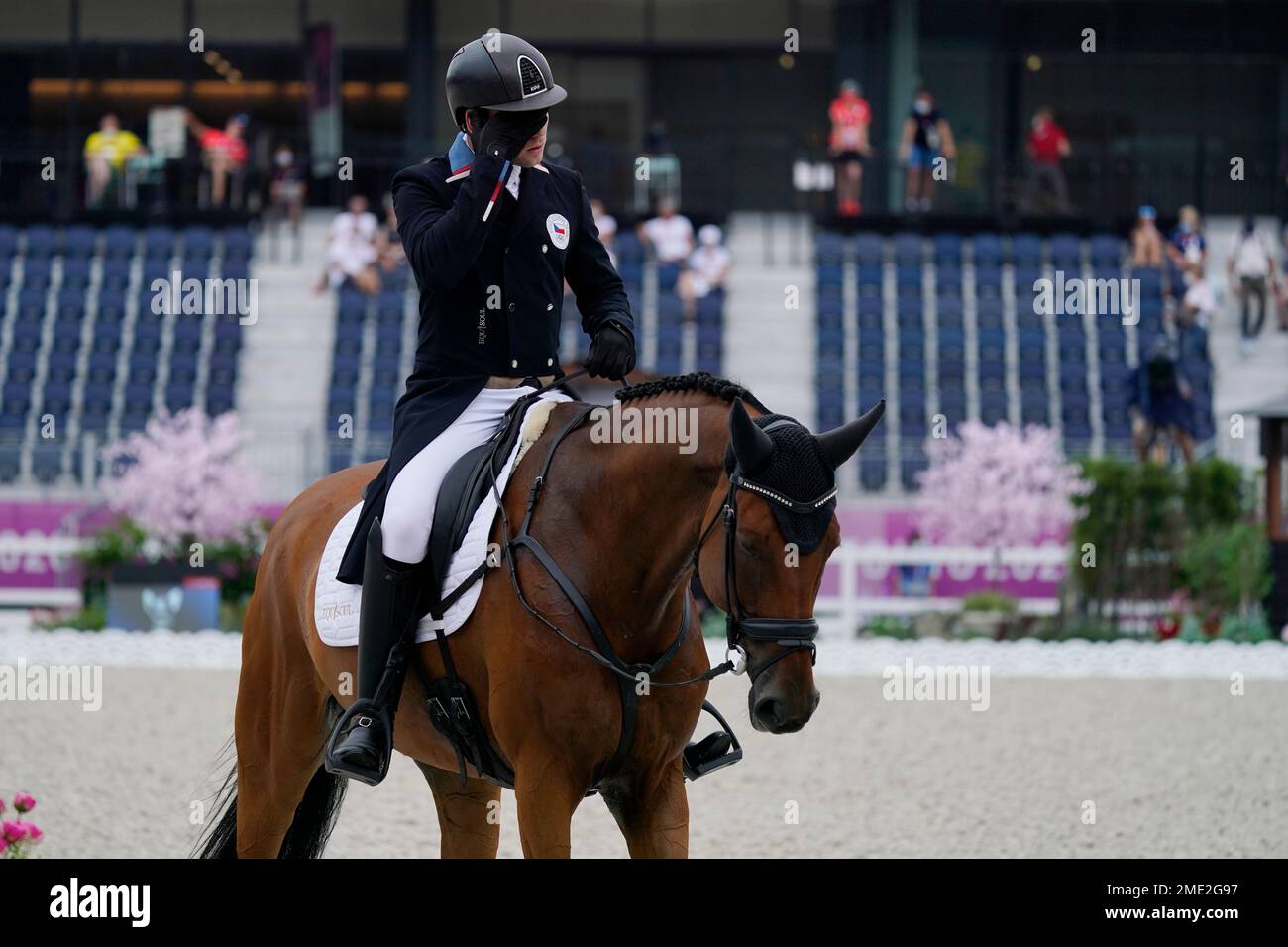 Czech Republic's Miloslav Prihoda Jr, riding Ferreolus Lat, wipes his ...