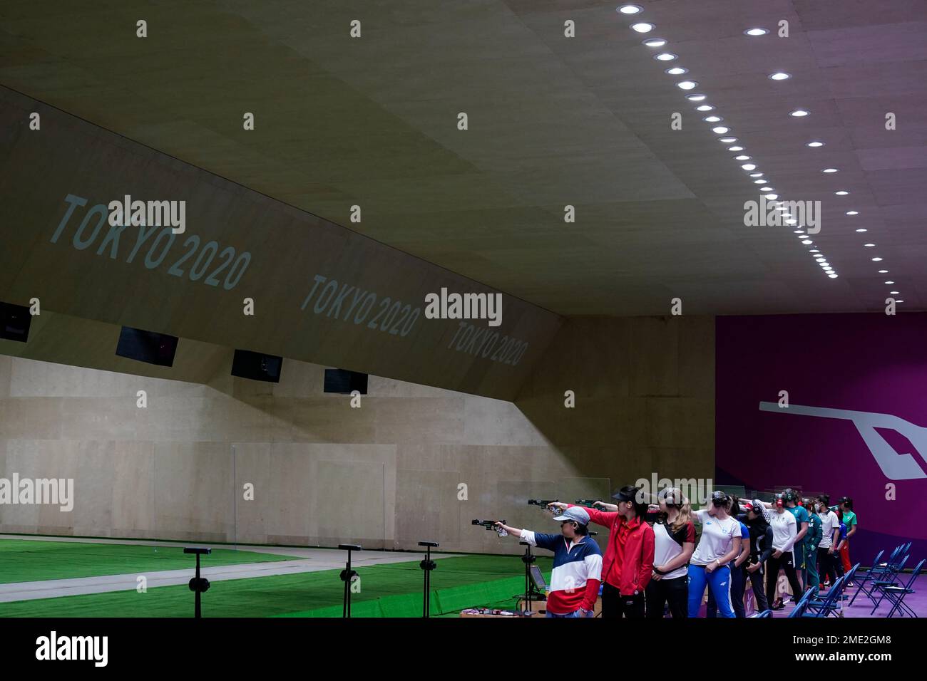 Athletes compete in the women's 25-meter pistol at the Asaka Shooting ...
