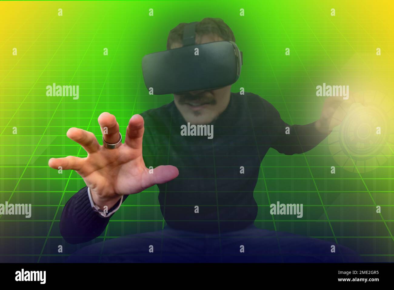 Young man is using virtual reality viewer. Modern man portrait with ...