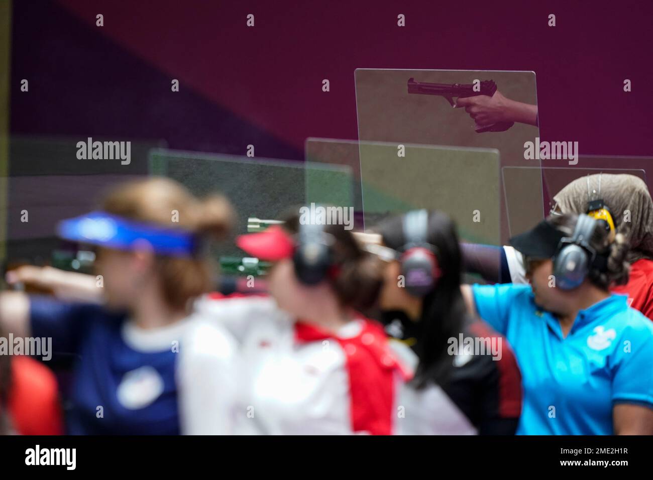 Athletes compete in the women's 25-meter pistol at the Asaka Shooting ...