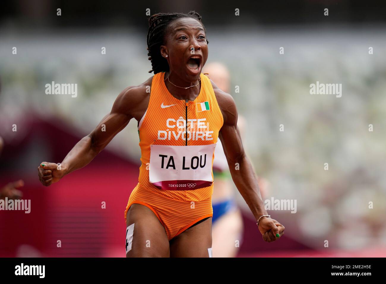 Marie-Josee Ta Lou, of the Ivory Coast, wins a heat in the women's 100 ...