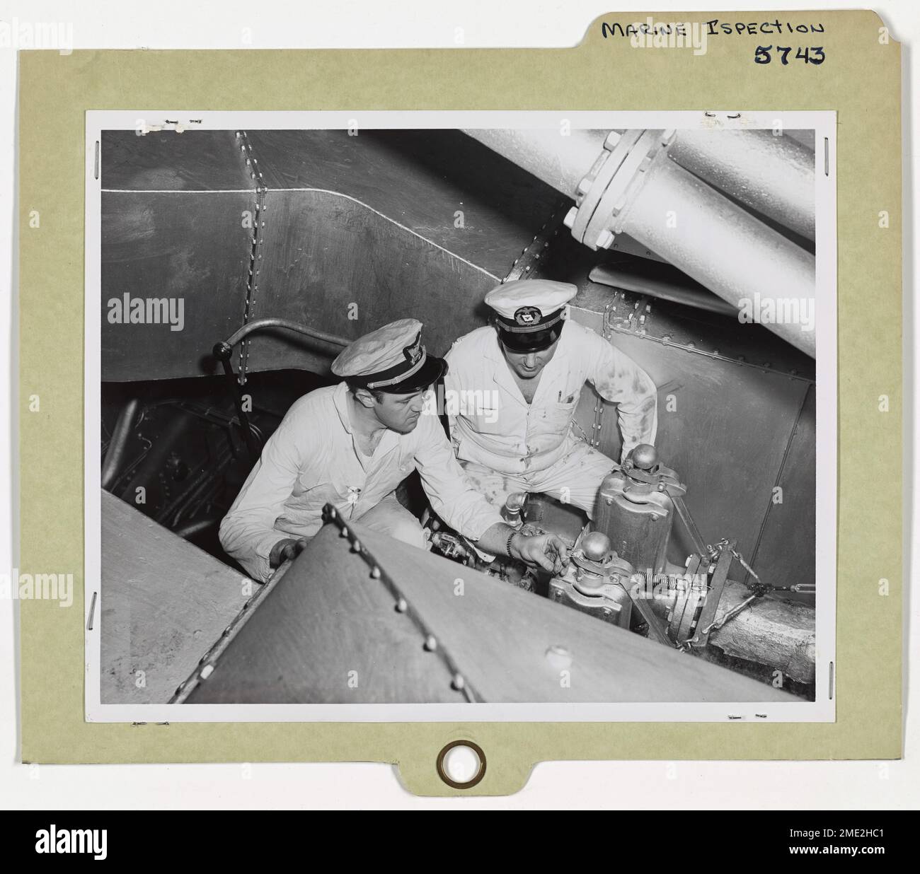A U.S. Coast Guard inspector, accompanied by a U.S. passenger ocean ...