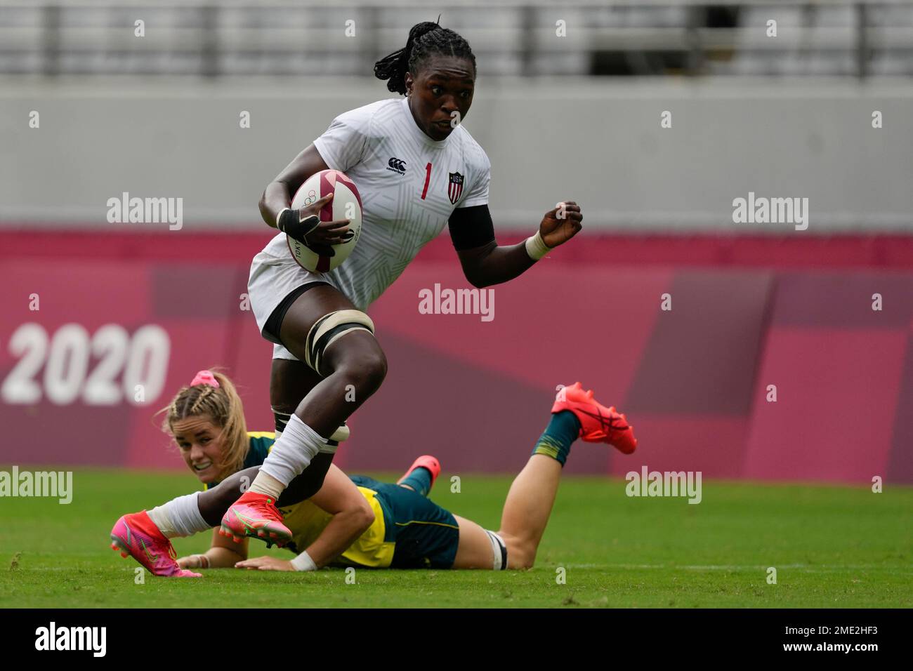 Cheta Emba of the United States races past Australia's Dominique du ...