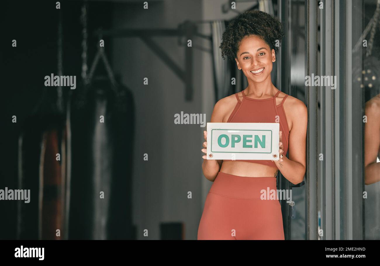 Fitness, portrait or personal trainer at gym with an open sign for ...