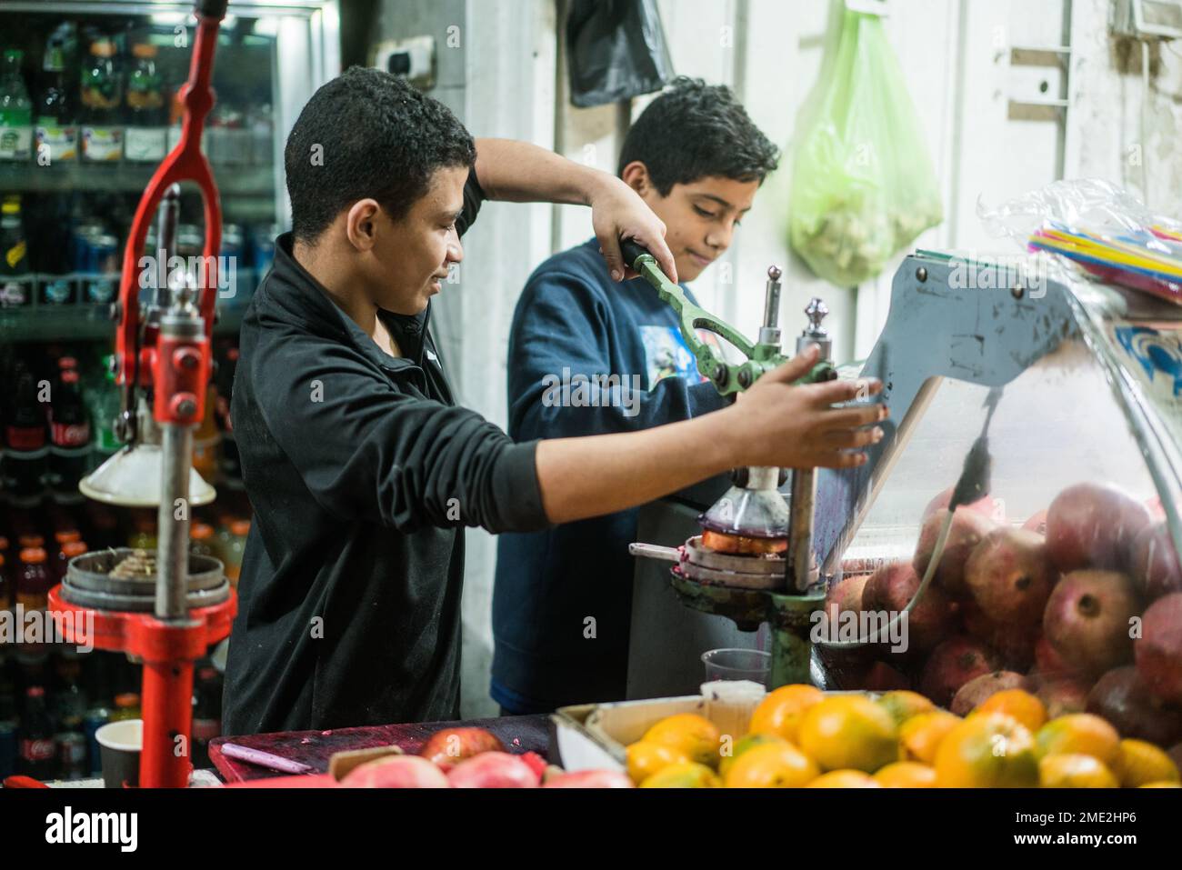 Street scene with boy making pomegranade juice in the Betlehem, Israel ...