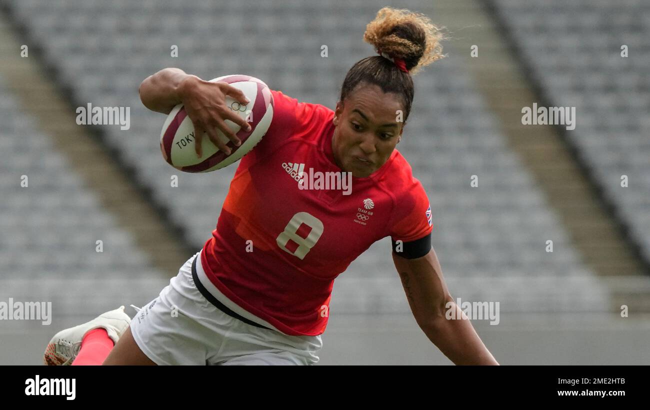 Britain's Celia Quansah leaps to avoid a tackle by Kenya's Janet Okello ...