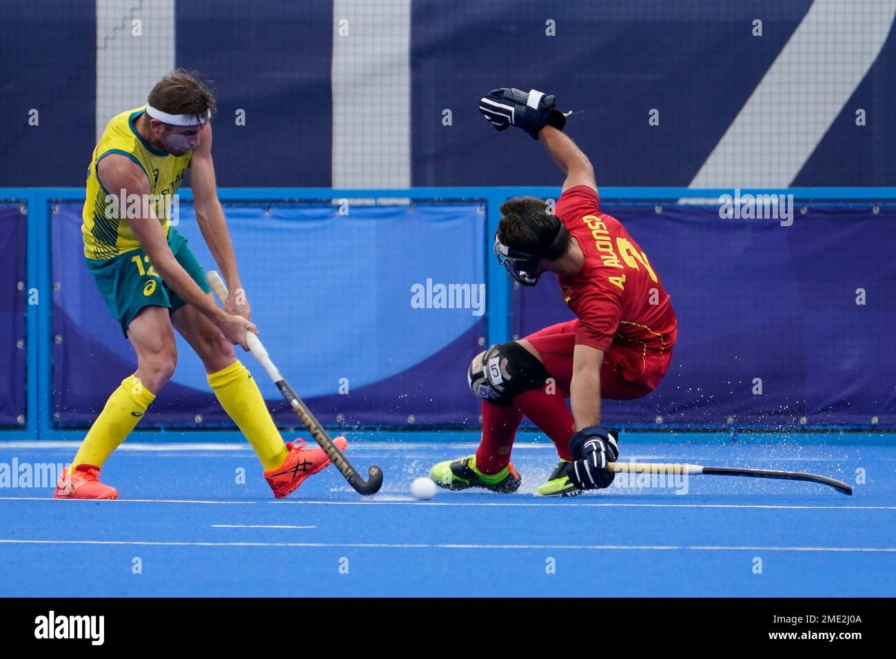 Spain's Alejandro Alonso (2) blocks a shot on goal by Australia's Jacob ...