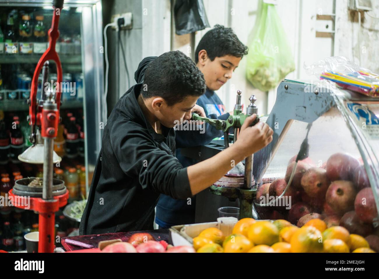 Street scene with boy making pomegranade juice in the Betlehem, Israel ...