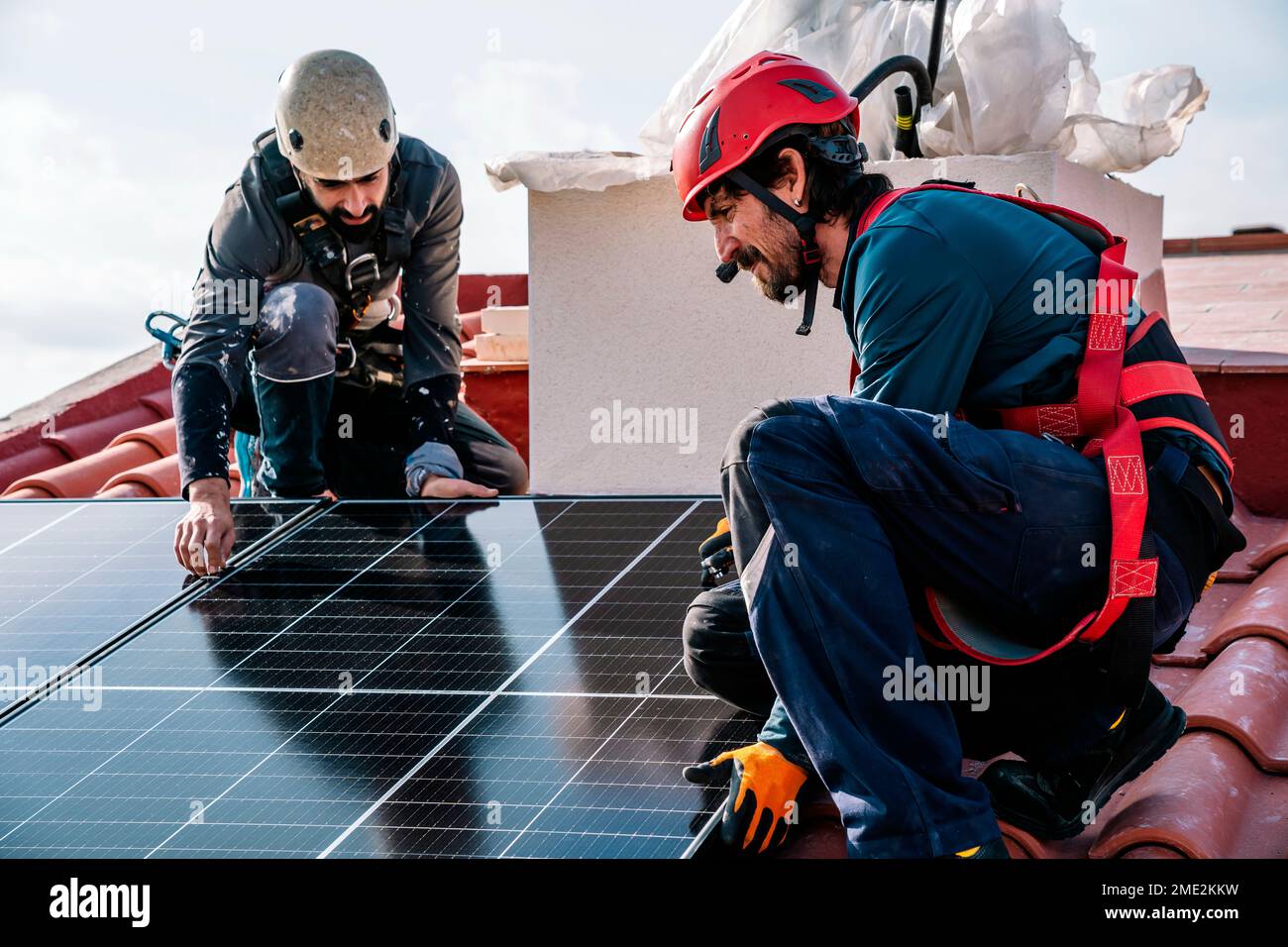 Installing solar panels on roof helmets hi-res stock photography and ...
