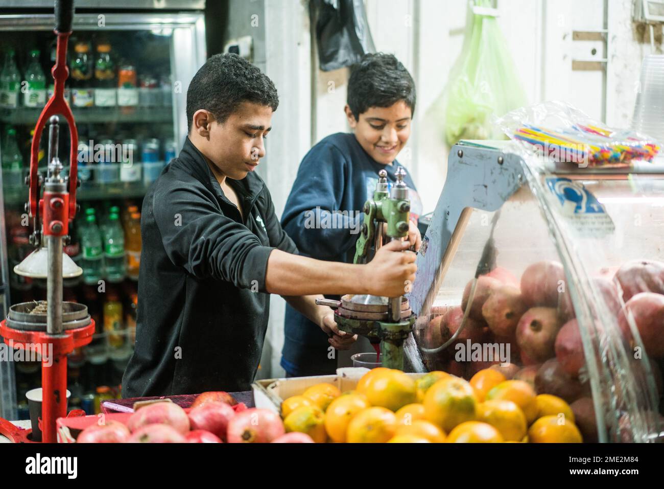 Street scene with boy making pomegranade juice in the Betlehem, Israel ...