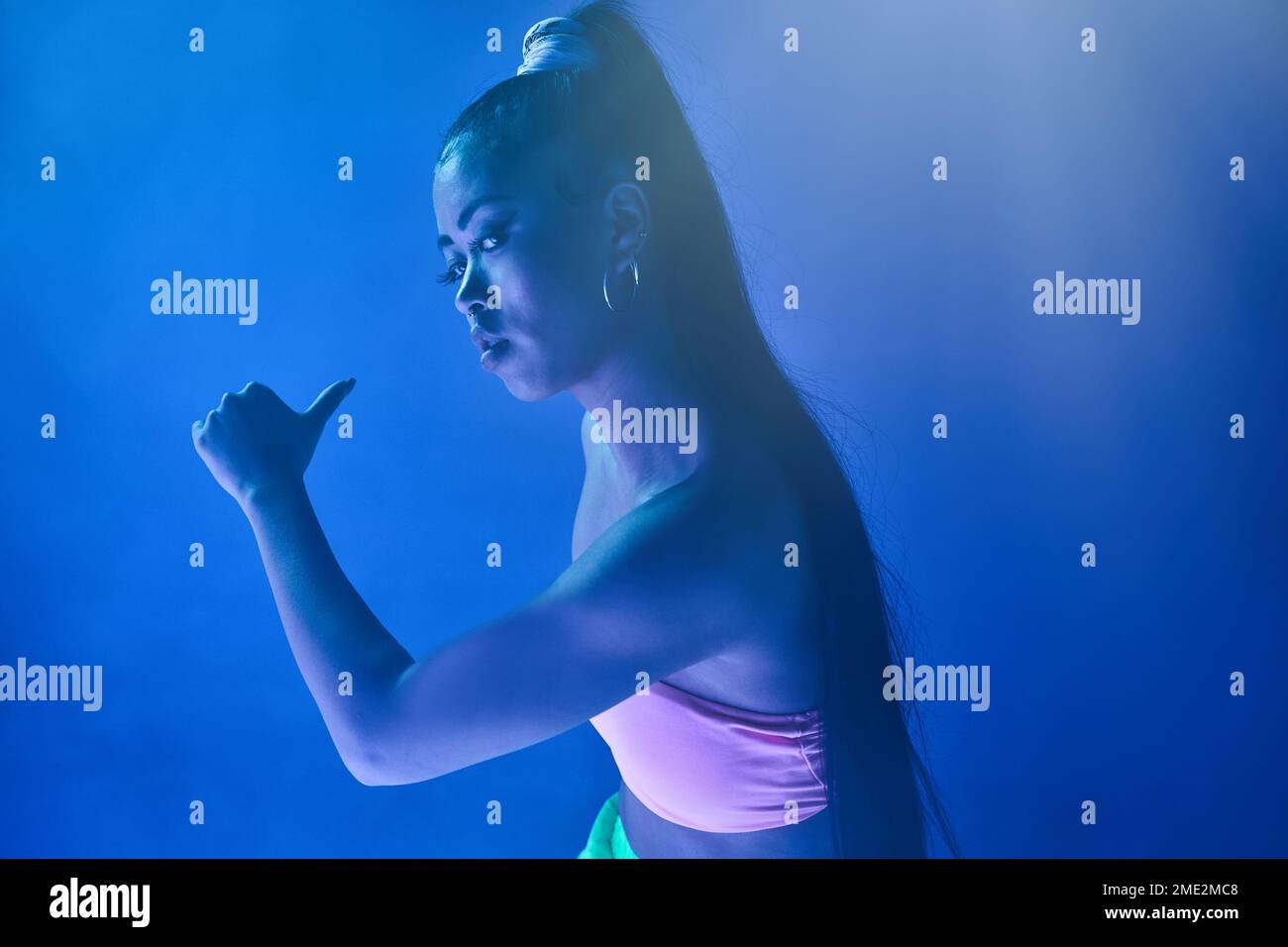 Young talented female dancer with long straight ponytail in white ...