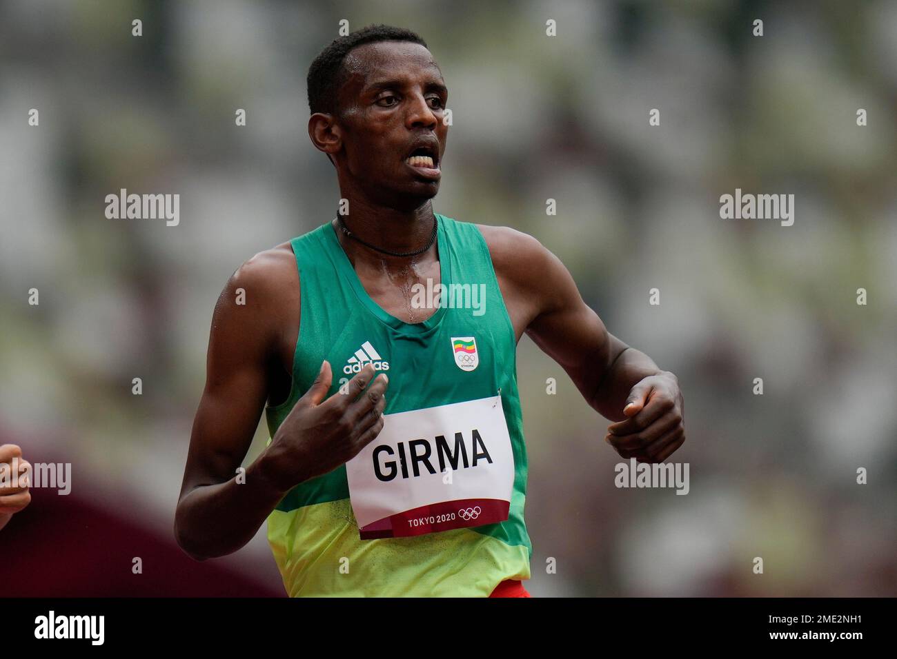 Lamecha Girma, of Ethiopia, wins in a heat of the men's 3,000-meter ...