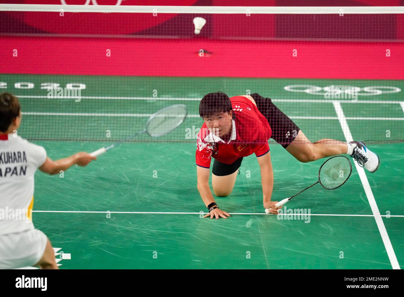 China's He Bing Jiao, right, plays against Japan's Nozomi Okuhara ...
