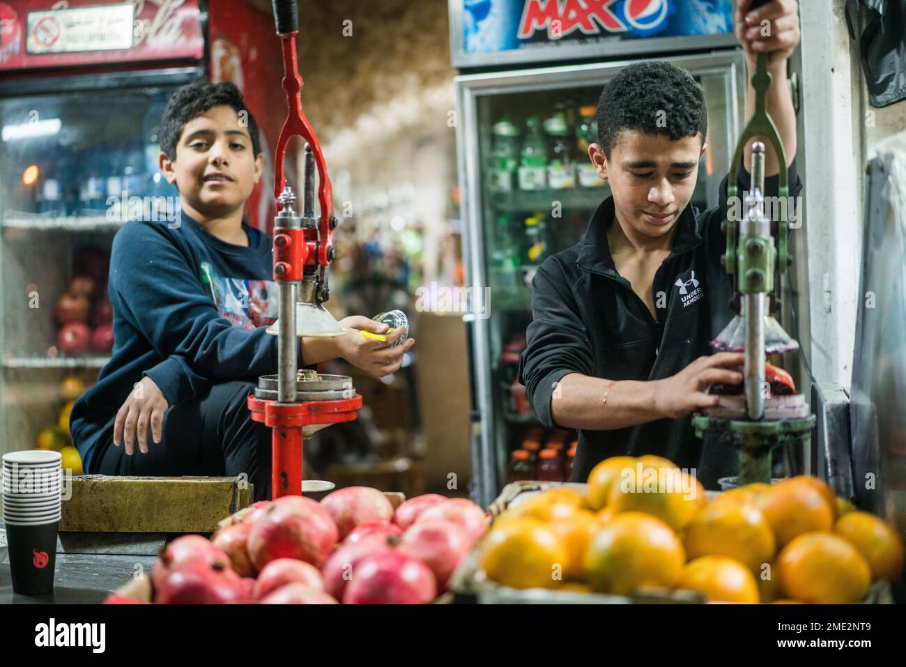 Street scene with boy making pomegranade juice in the Betlehem, Israel ...