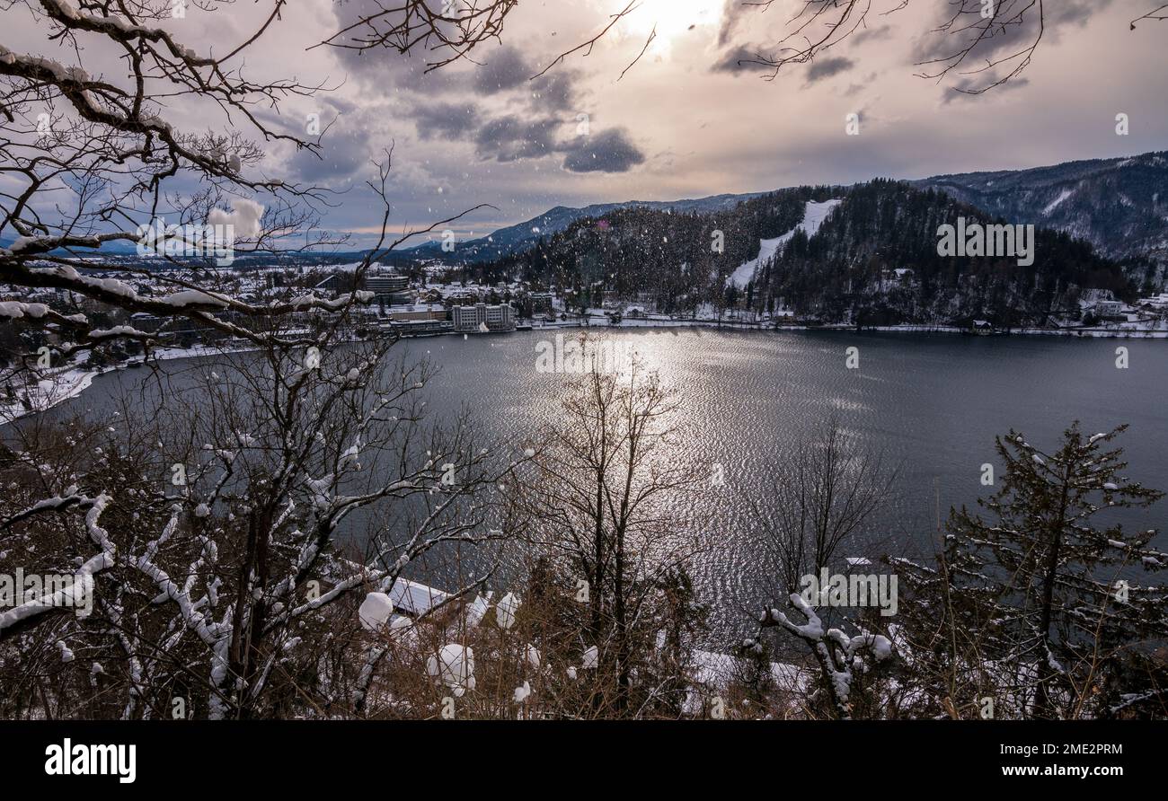 Glimpse of Lake Bled from the climb towards the castle. Winter day with ...