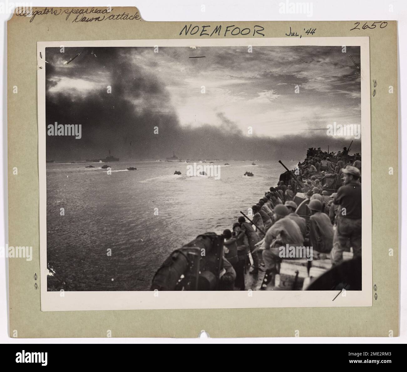 This image shows Coast Guard-manned 'alligators' (LSTs) leading the ...