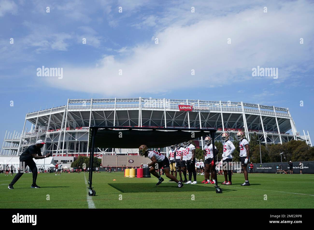 San Francisco 49ers linebacker Fred Warner, bottom center, runs a drill ...