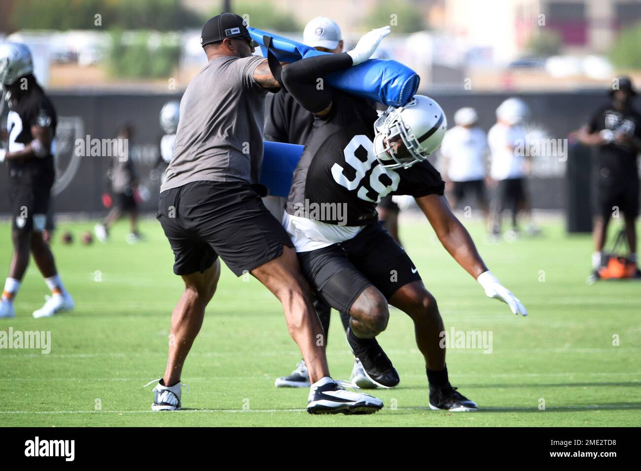 Las Vegas Raiders defensive end Clelin Ferrell runs a drill during an ...