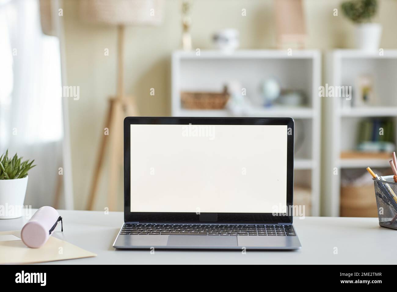 Background image of open laptop with blank white screen mockup on ...
