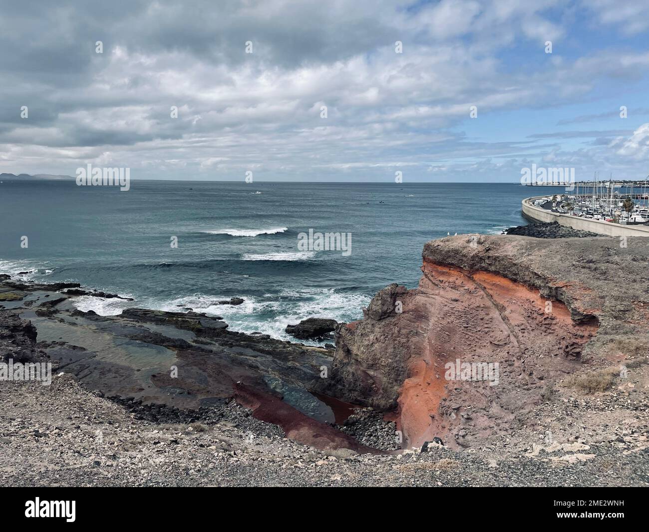A breathtaking view of sea waves crashing on a volcanic rocky beach, on ...