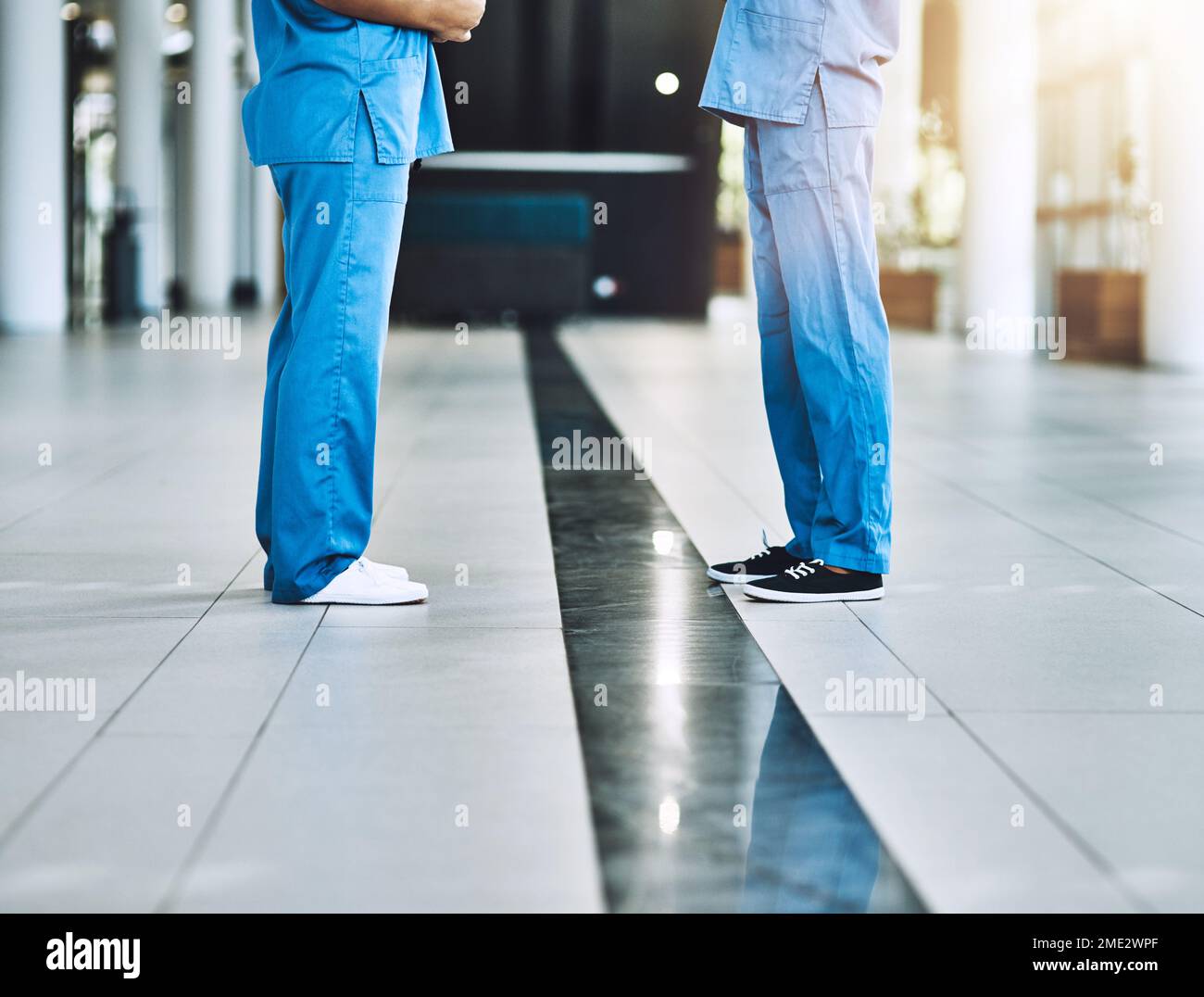 Discussing the best treatment. two medical practitioners having a ...