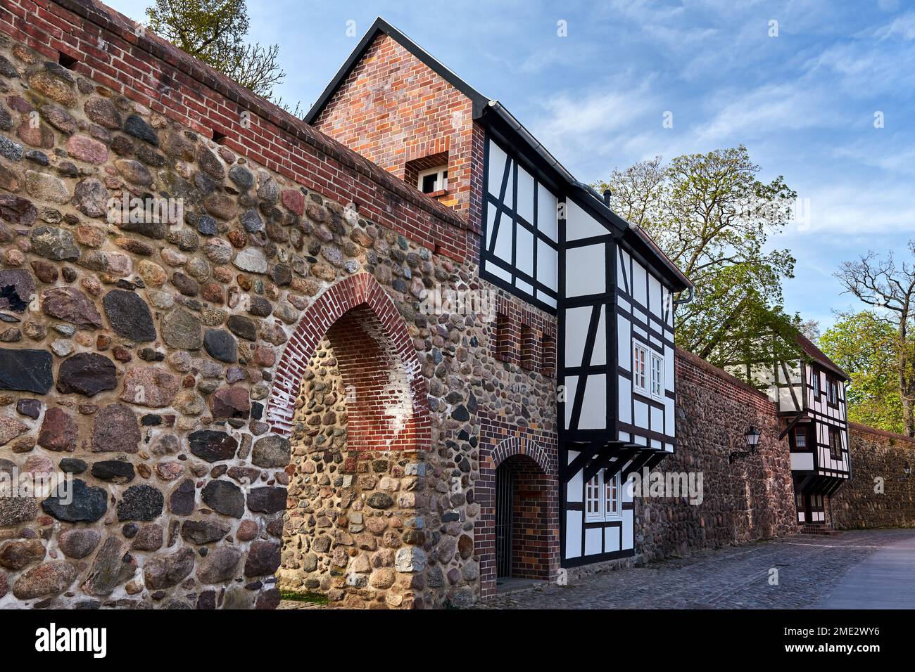 Stone, medieval walls with a historic, multi -story house in the city ...