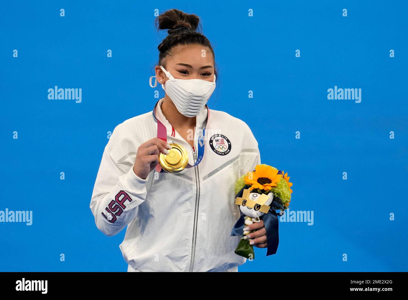 Sunisa Lee of the Unites States displays her gold medal for the ...