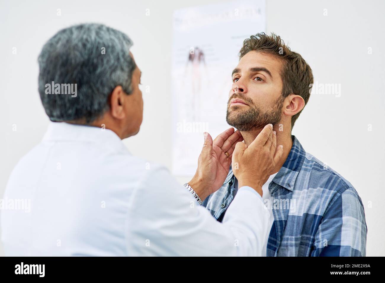 Your throat sees to be fine. a confident mature male doctor running ...