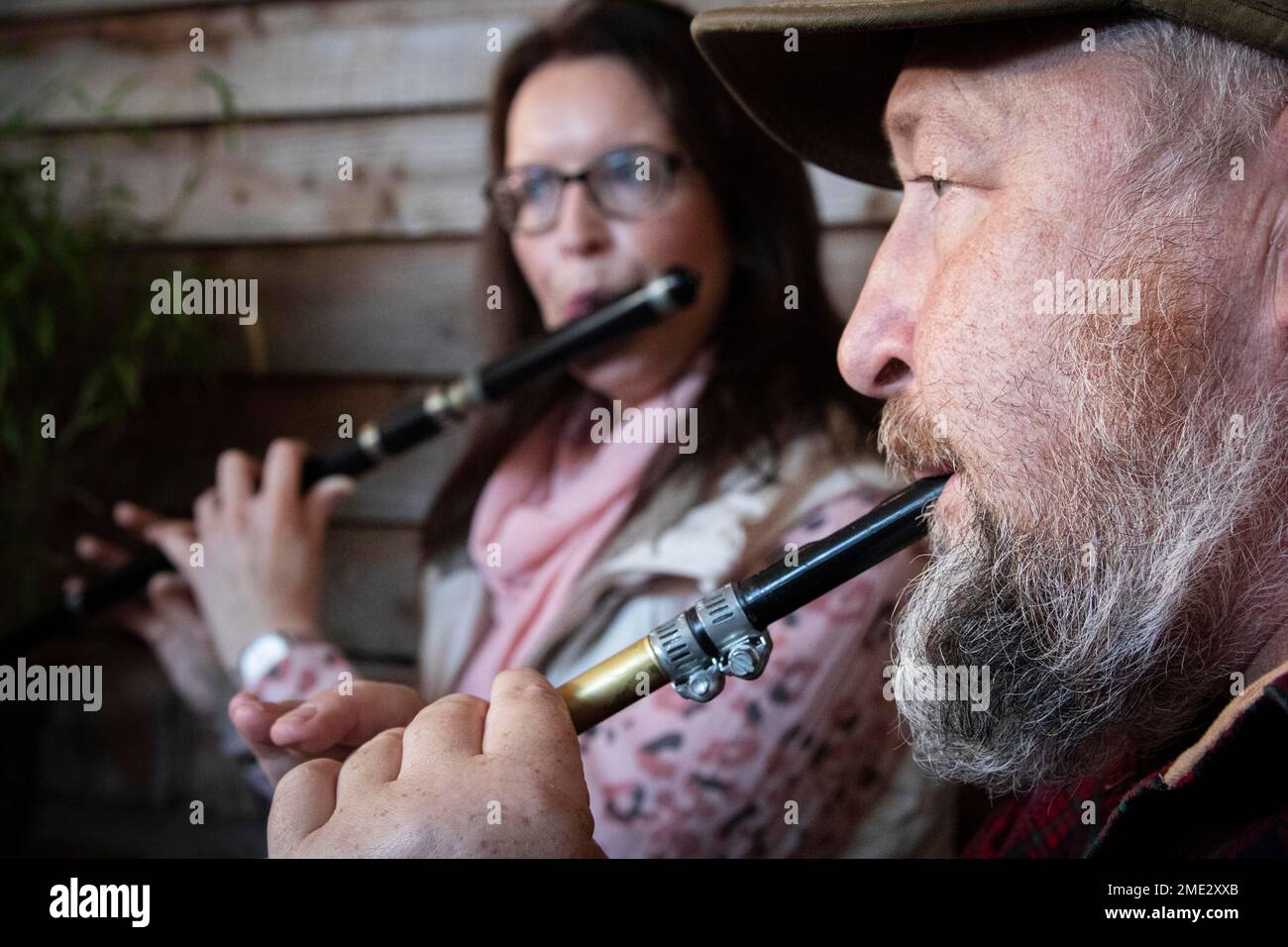 The people playing flutes at an Irish Traditional Music session at a ...