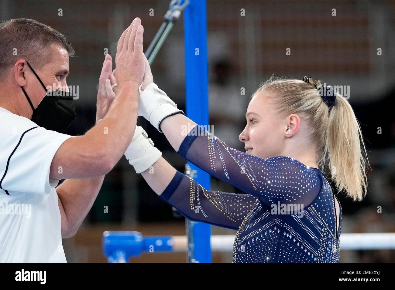 Jade Carey, of the United States, is greeted by Coach Laurent Landi ...