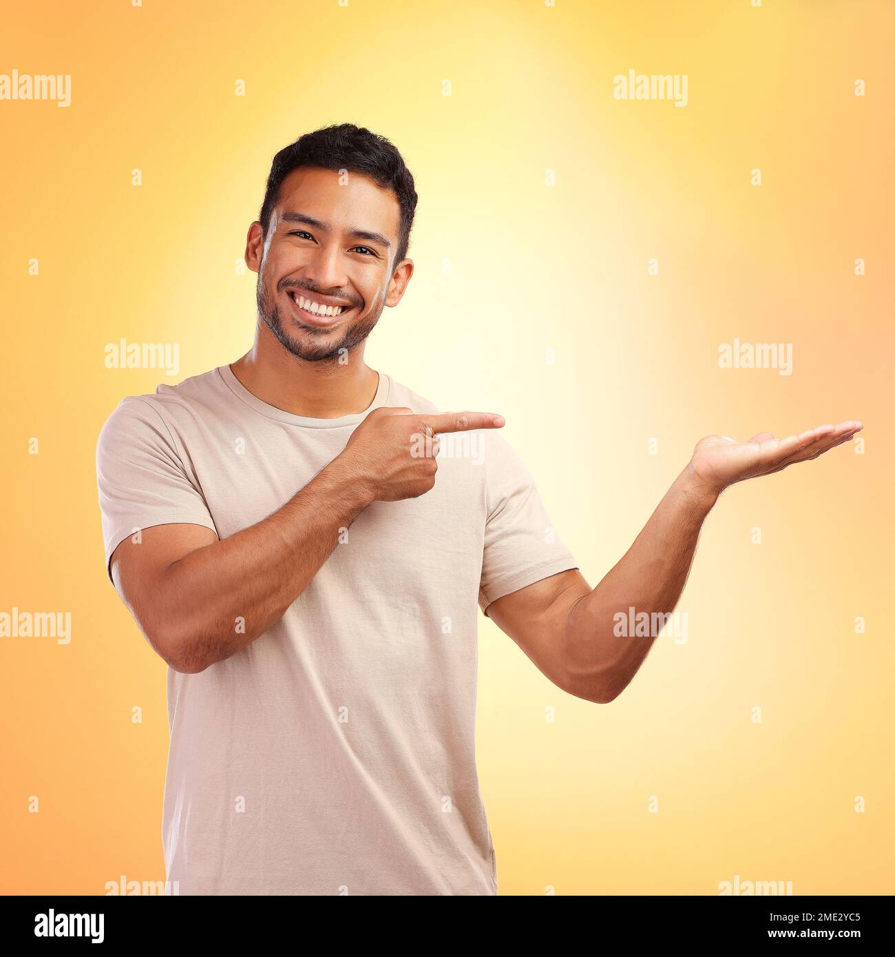 Portrait, pointing and man with product placement in studio isolated on ...