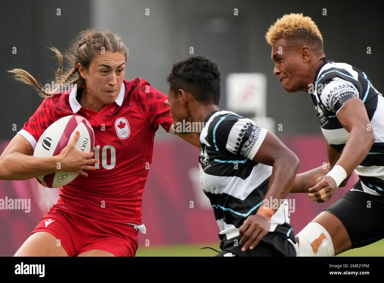 Canada's Kaili Lukan, left, comes under pressure from Fiji's Viniana ...