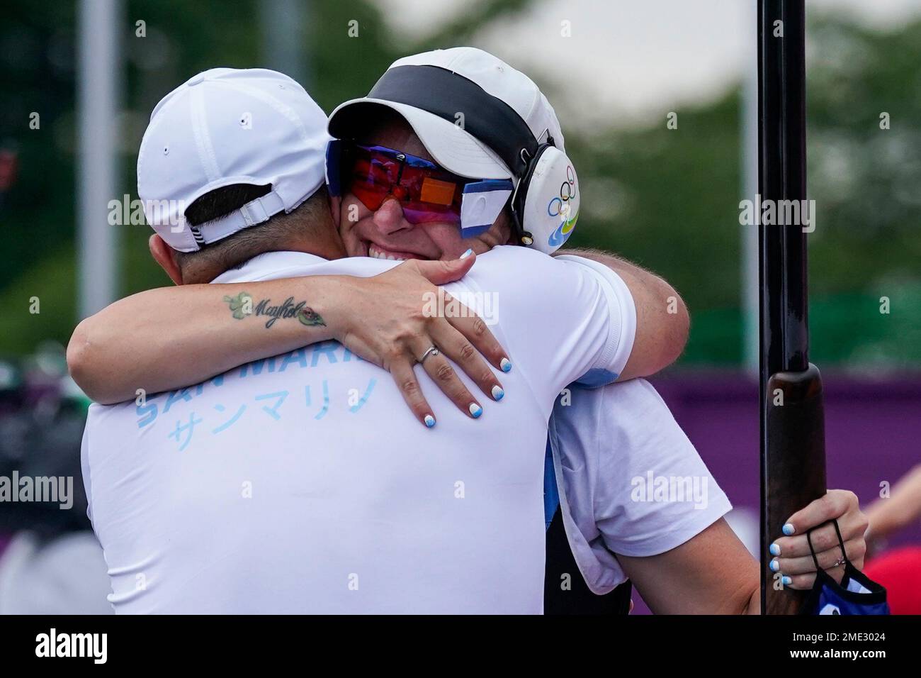 Alessandra Perilli, right, of San Marino, hugs her coach as she ...