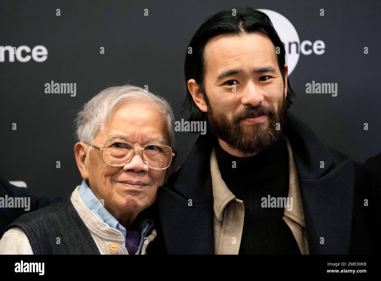 Sing J. Lee, right, director/co-writer of "The Accidental Getaway Driver," poses with cast ...